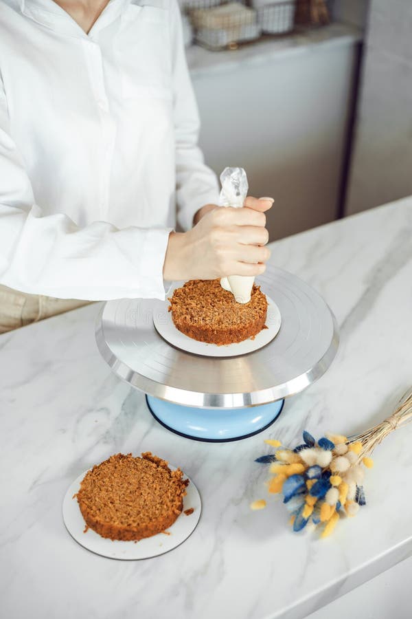 Confectionery, Baking and Cooking Concept - Woman Making Cake in the ...