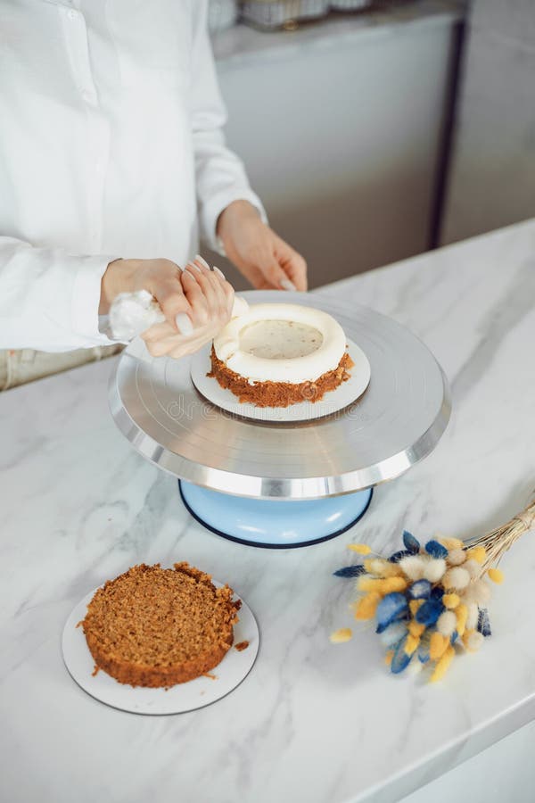 Confectionery, Baking and Cooking Concept - Woman Making Cake in the ...