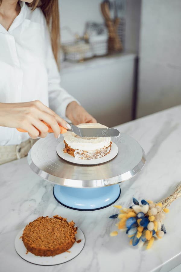 Confectionery, Baking and Cooking Concept - Woman Making Cake in the ...