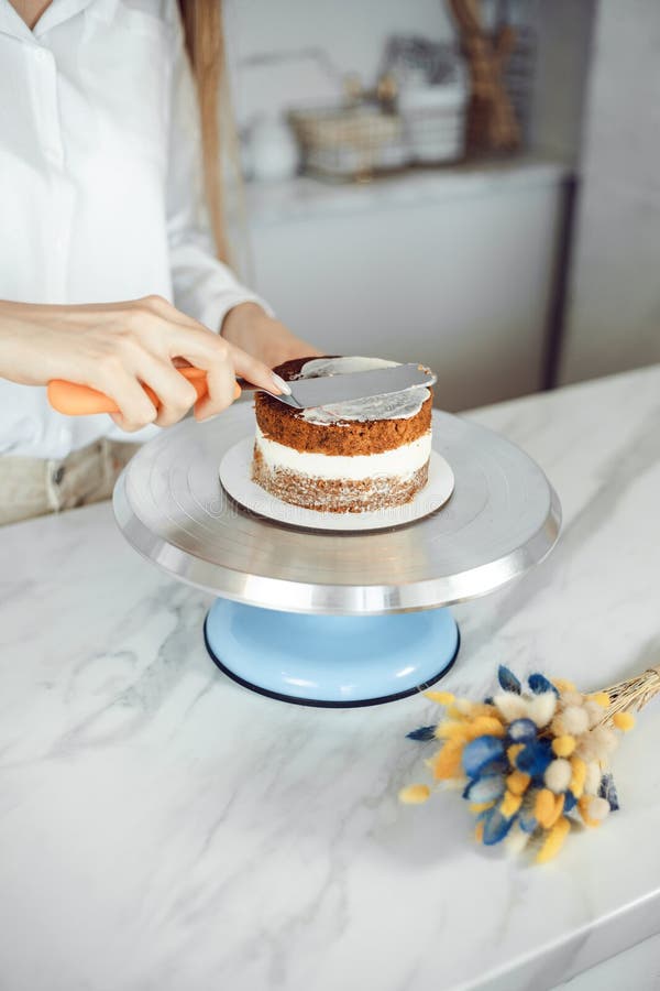Confectionery, Baking and Cooking Concept - Woman Making Cake in the ...