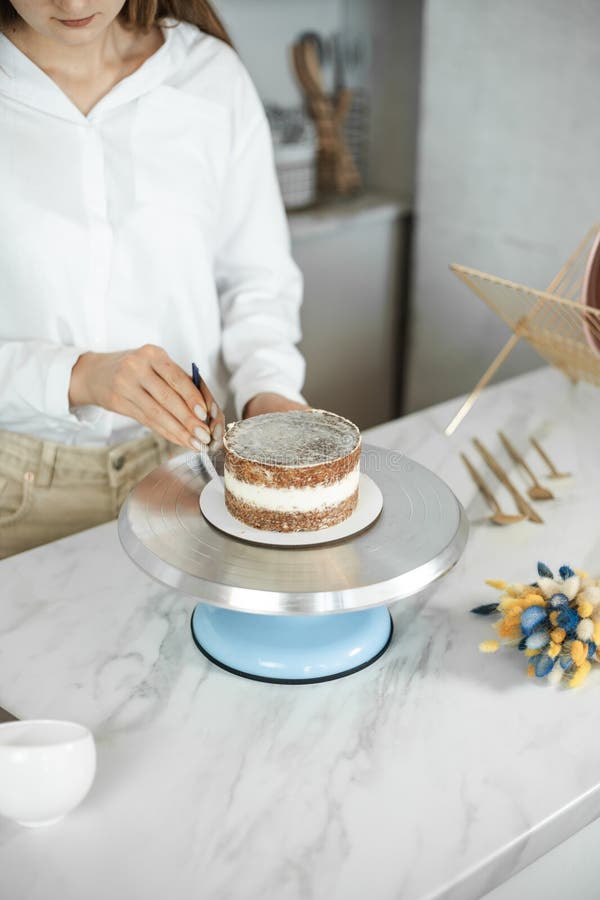 Confectionery, Baking and Cooking Concept - Woman Making Cake in the ...