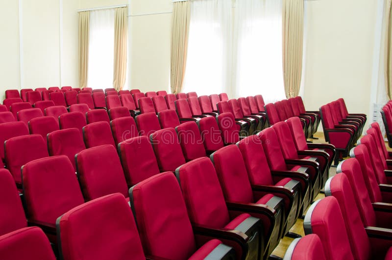 Conference Hall with Red Comfortable Chairs and Beige Walls with ...