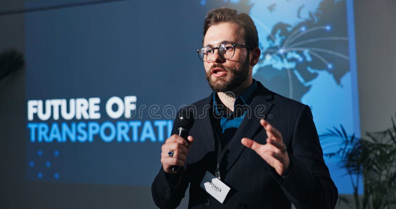 Conference, Microphone and Speech with Man on Stage for Presentation on Future of Transportation ...