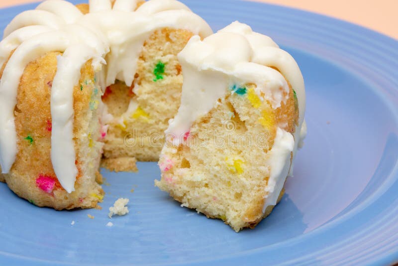Confetti Bunt Cake on Blue Plate Stock Photo - Image of overhead, glaze ...