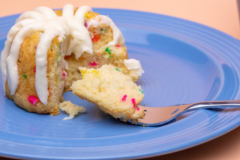Confetti Bunt Cake on Blue Plate Stock Photo - Image of icing, colours ...