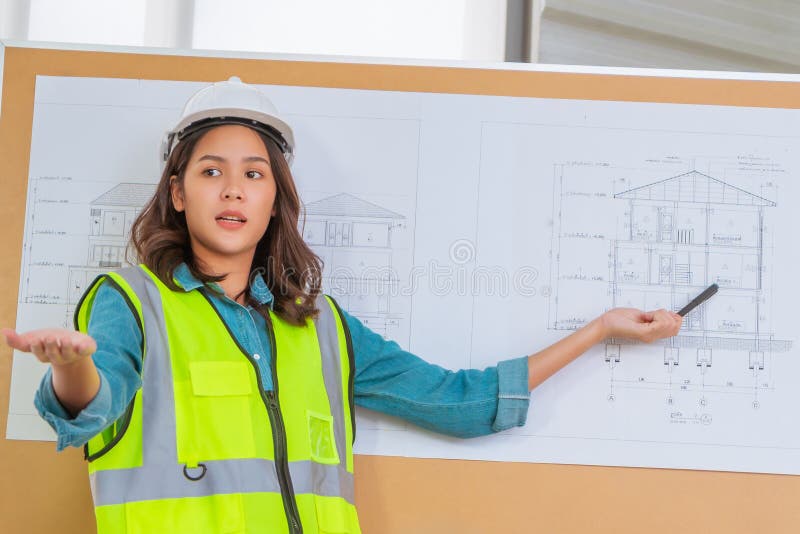 Confidence Female Engineer is Presenting Building Plan Drawing on the ...