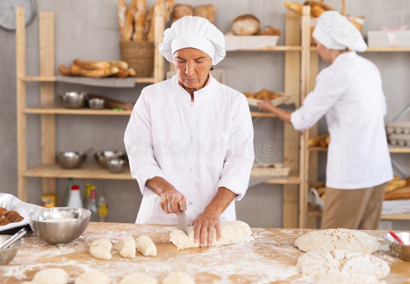 Confidence Elderly Female Baker in White Uniform Standing at Work Table ...