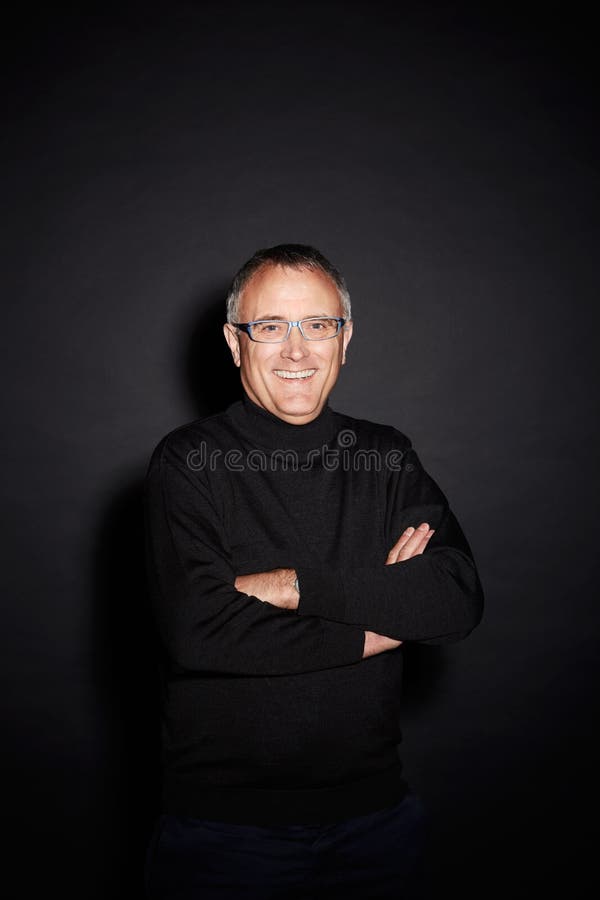 Confidence is Key. a Mature Man Standing with His Arms Folded in the ...