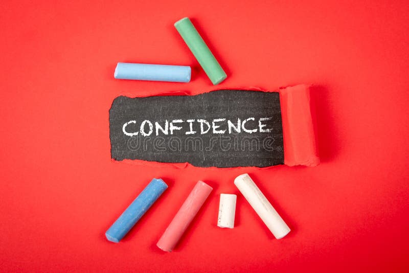 Confidence. Word Under Torn Red Paper on a Blackboard Stock Photo ...