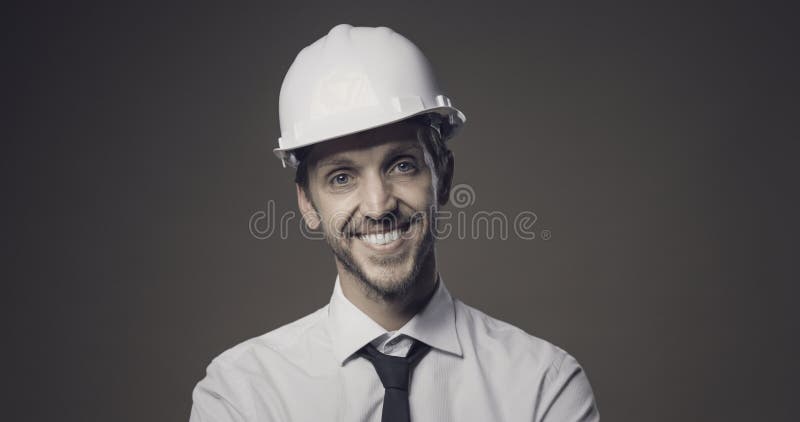 Confident Architect Smiling and Wearing a Safety Helmet Stock Photo ... Confident Architect Smiling and Wearing a Safety Helmet Stock Photo ...