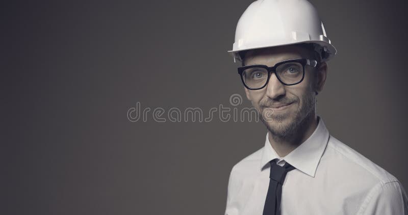 Confident Architect Smiling and Wearing a Safety Helmet Stock Image ... Confident Architect Smiling and Wearing a Safety Helmet Stock Image ...