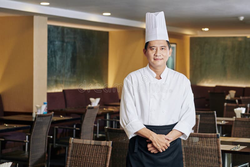 Asian chef and a waitress stock image. Image of waitress - 53463645