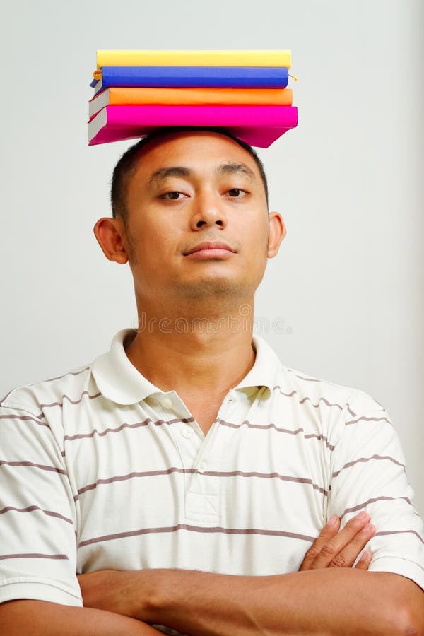 Confident Asian Young Man with Books on Head Stock Image - Image of ...