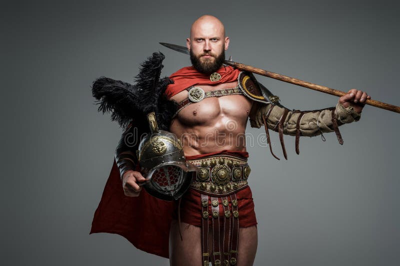 Confident Bald Gladiator with Light Armor Holding a Spear and Gladiator ...