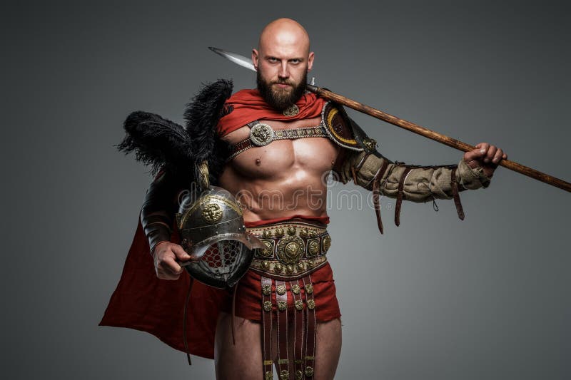 Confident Bald Gladiator with Light Armor Holding a Spear and Gladiator ...