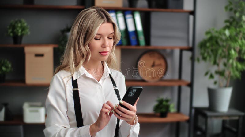 Confident Beautiful Young Blonde Business Woman Chatting Smartphone at ... Confident Beautiful Young Blonde Business Woman Chatting Smartphone at ...