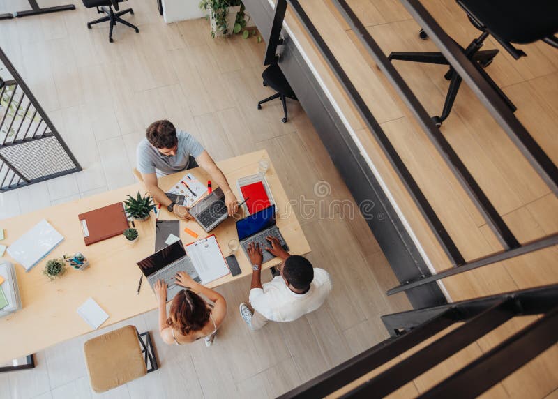 A Confident Group of Businesspeople in a Modern Office, Working ...