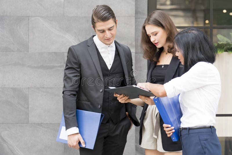 Business People Talking in Front of the Building. Confident Business ...