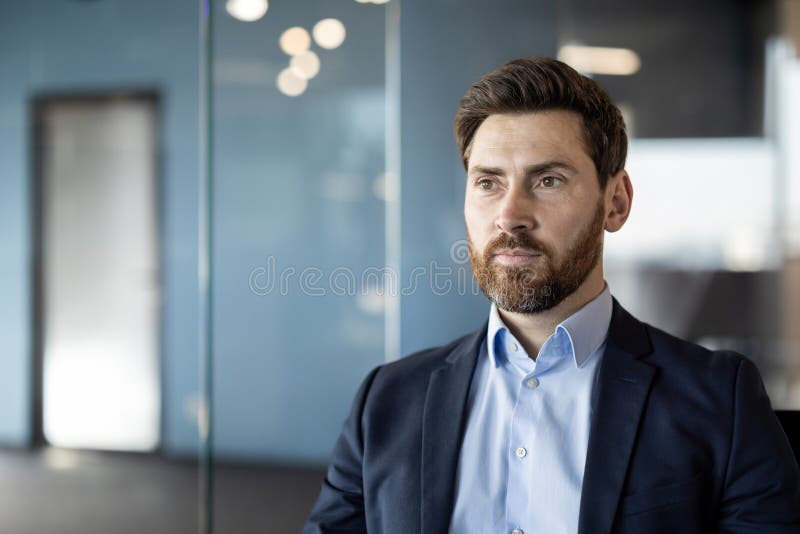 Confident Business Professional in Office Environment Looking Ahead ...