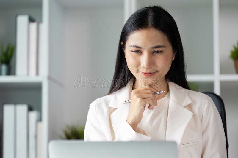 Confident Business Professional Working at Desk in Modern Office with ...