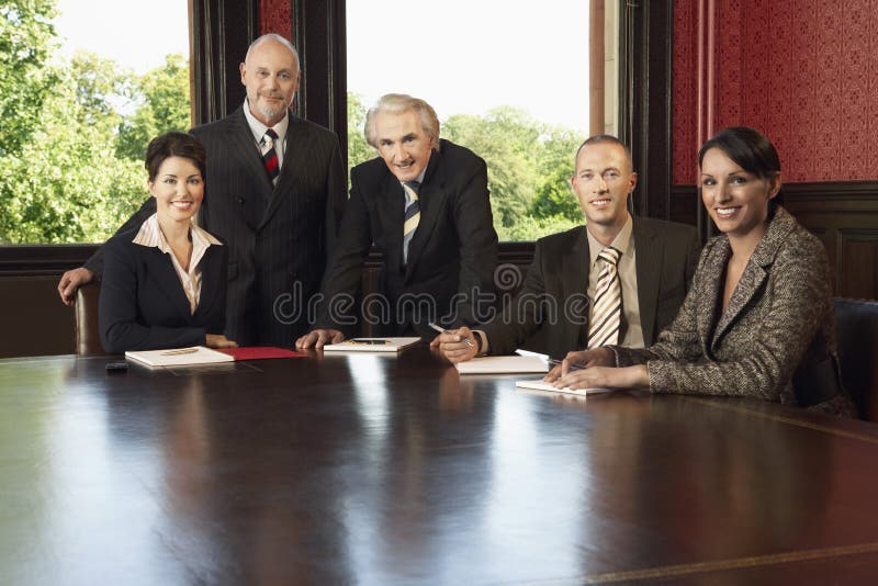 Confident Business Team at Conference Table Stock Photo - Image of ...