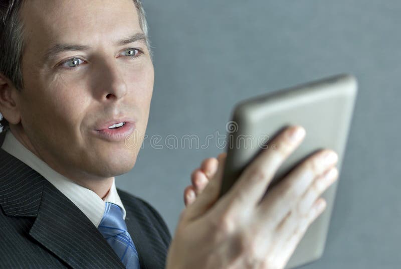 Confident Businessman Gesturing To Tablet Computer Stock Photo - Image ...