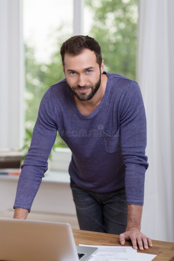 Confident Businessman Leaning on His Desk Stock Image - Image of ...