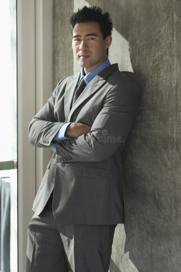 Confident Businessman Leaning on Wall Stock Photo - Image of ...