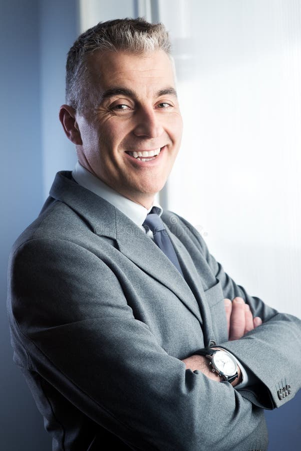 Confident Businessman Posing In The Office Stock Photo - Image of ... Confident Businessman Posing In The Office Stock Photo - Image of ...