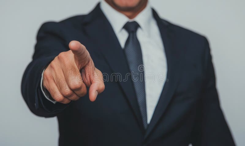 A Confident Businessman Pointing with Authority and Determination Stock ...