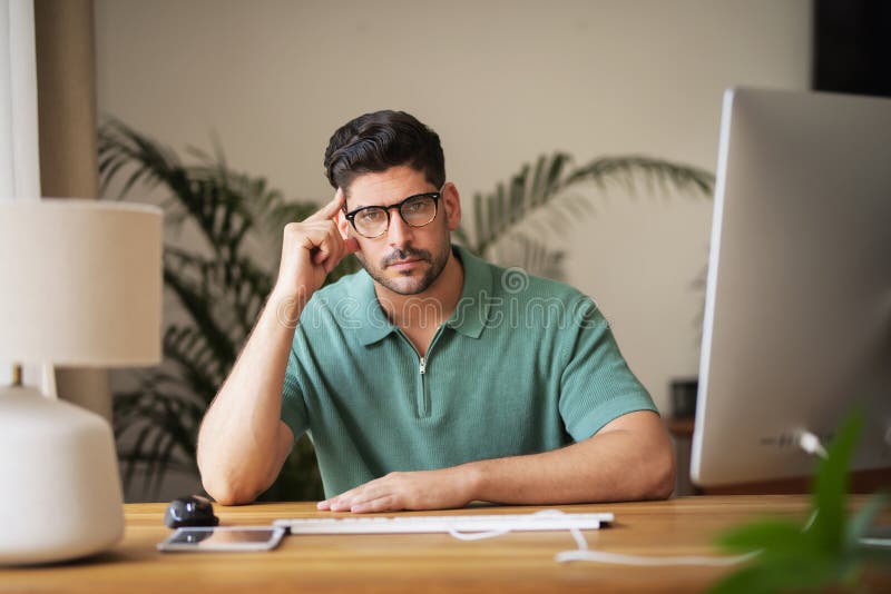 Confident Businessman Sitting at Home and Using Computer for Work Stock ...