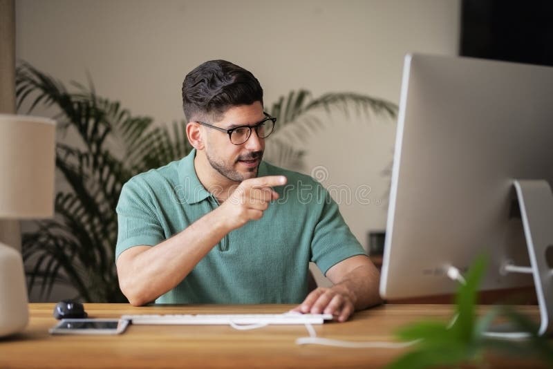 Confident Businessman Sitting at Home and Using Computer for Work Stock ...