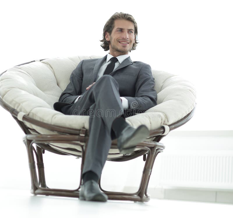 Confident Businessman Sitting in a Large Comfortable Chair. Stock Image ... Confident Businessman Sitting in a Large Comfortable Chair. Stock Image ...