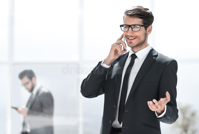 Confident Businessman Talking on a Mobile Phone. Stock Photo - Image of ...