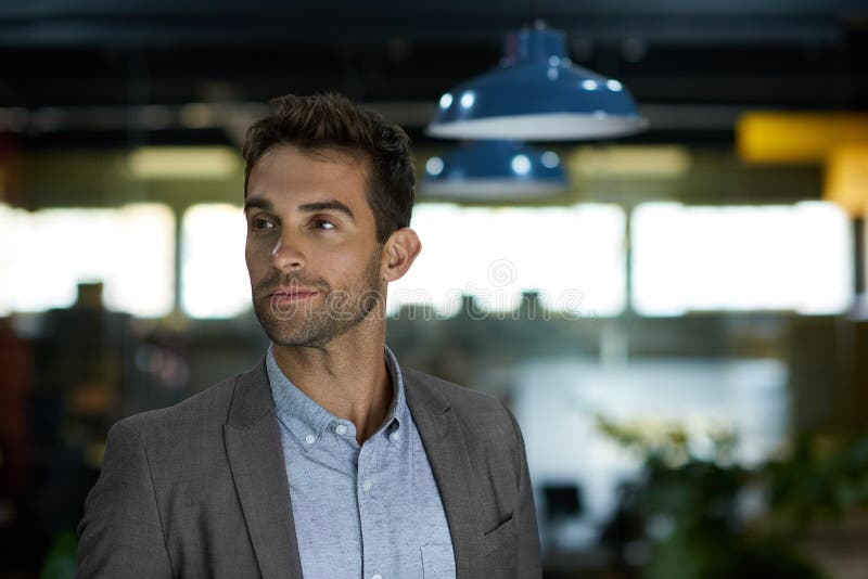 Confident Businessman Thinking about Work while Standing in an Office ...