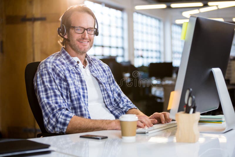 Confident Businessman Working at Computer Desk Stock Image - Image of ...