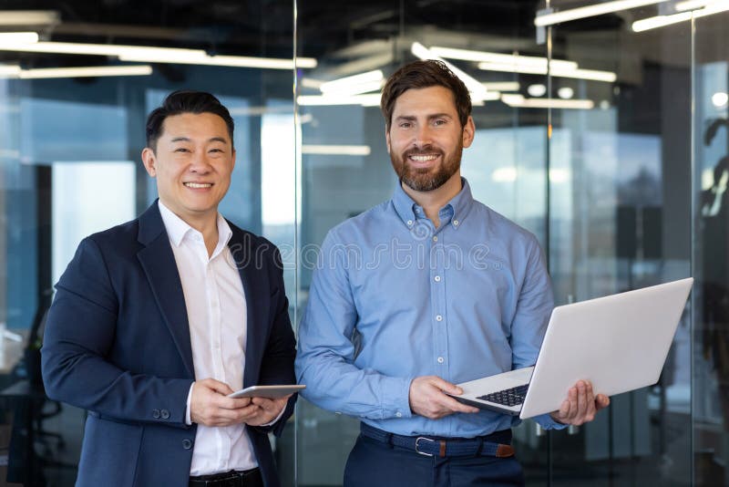 Confident Businessmen Collaborating in Modern Office Environment ...