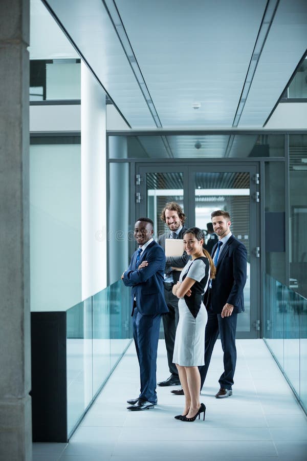 Confident Businesspeople Standing in Office Stock Image - Image of ...