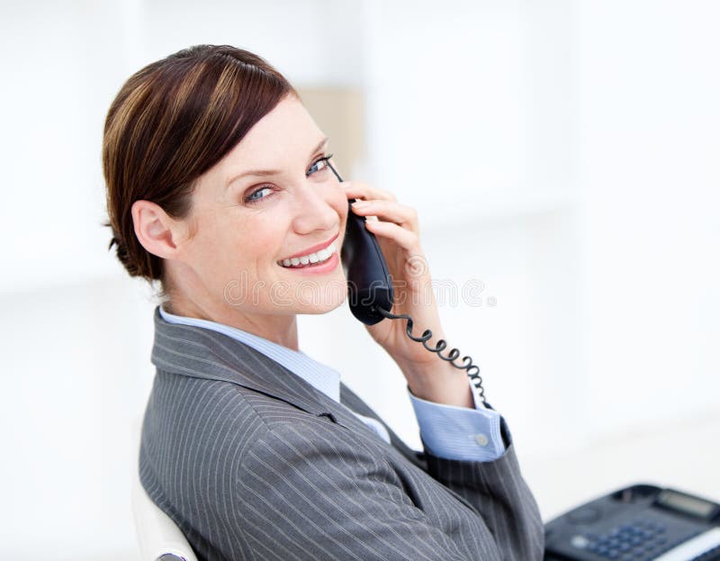Confident Businesswoman on Phone at Her Desk Stock Image - Image of ...