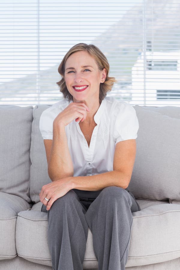 Confident Businesswoman Sitting on Couch Stock Photo - Image of ...