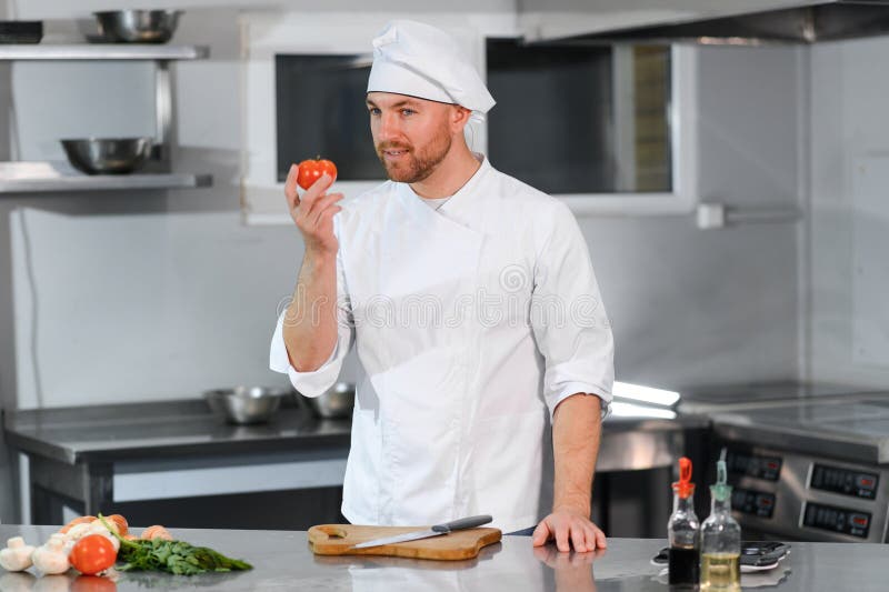 Confident Chef Standing in the Kitchen at Restaurant Stock Photo ...