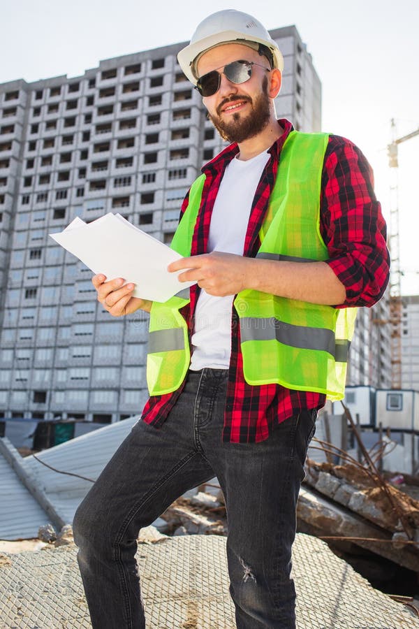 Confident Construction Engineer in Hardhat with Using Cell Phone on ...