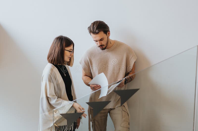 Successful Coworkers in a Modern Office Collaborating and Discussing ...