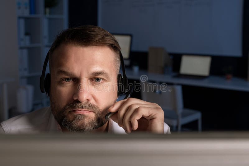 Confident Customer Support Representative with Headset Speaking in ...