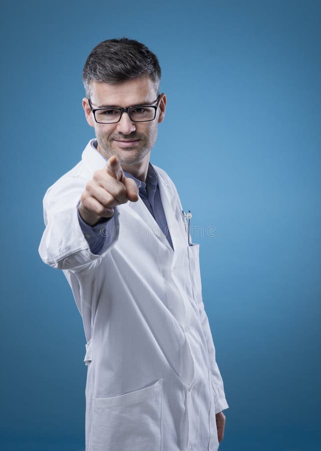 Confident doctor pointing stock photo. Image of insurance - 50966320