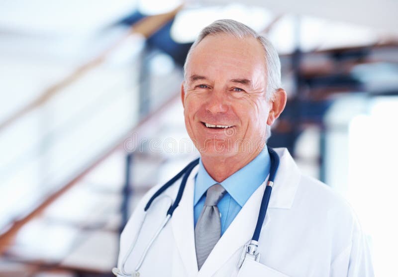 Confident Doctor Smiling with Stethoscope. Portrait of Mature Doctor ...