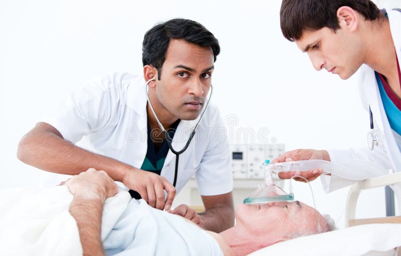 Confident Doctors Resuscitating a Patient Stock Image - Image of ...
