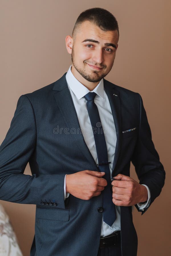 Confident Elegant Handsome Guy at Home Sitting on the Couch Stock Photo ...