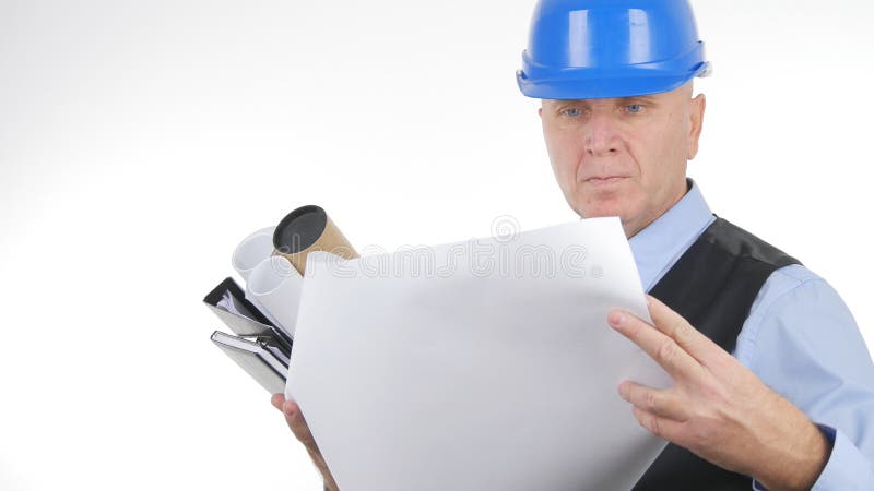Confident Engineer Reading Technical Plans on White Background Stock ...