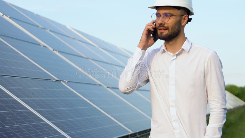 Confident Engineer Wearing Safety Hard Hat, Holding Mobile Phone ...